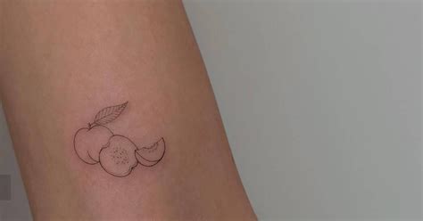 Peach Tattoo In Fine Line Style Located On The Bicep