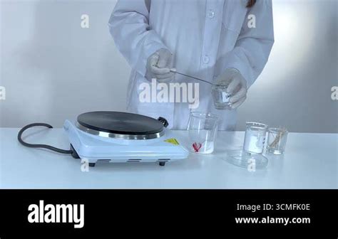 Scientist Demonstrates Sodium Acetate Crystallization Process Stock Video Footage Alamy
