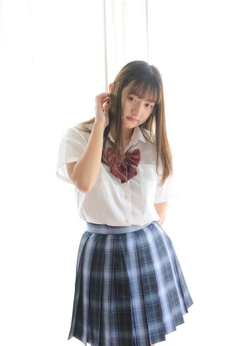 Portrait Japanese School Girl Uniform In White Tone Bed Room Stock