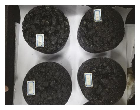 Gyratory Compacted Specimen And Uniaxial Compression Test A Gyratory Download Scientific