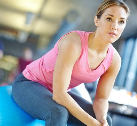 Taking A Quick Break Between Workouts A Young Woman Resting After Her