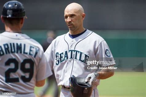 First Base Coach Mike Brumley Talks With Raul Ibanez Of The Seattle
