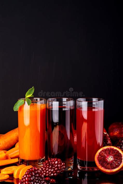 Different Healthy Vegan Drinks On The Black Background Raw Drinks And