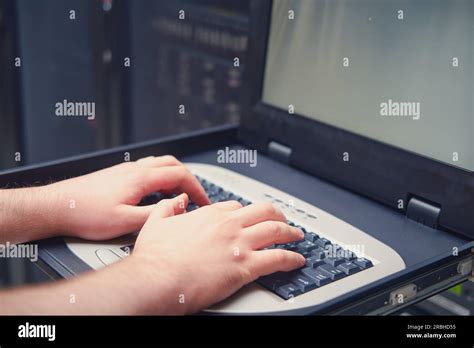 The Terminal Keyboard And Monitor Screen In The Server Room Provide Easy Access To Critical
