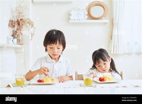 Japanese Brother And Babe Eating Stock Photo Alamy