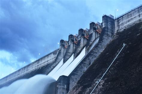 Water Splashing From Floodgate Khun Dan Prakarn Chon Huge Concrete Dam On Night In Thailand