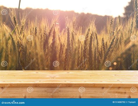 Wood Board Table In Front Of Field Of Wheat On Sunset Light Ready For Product Display Montages