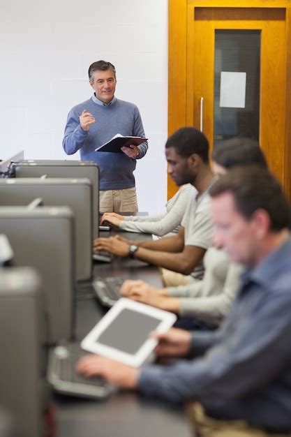 Premium Photo Teacher Talking To His Computer Class