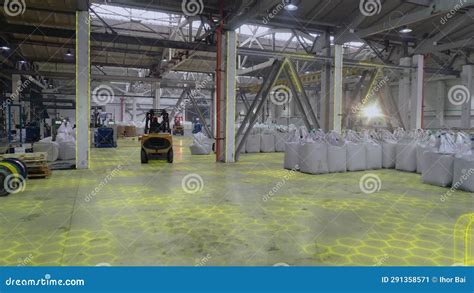 Forklift Drives Through The Warehouse Workflow In A Factory Concept