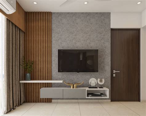Spacious Tv Unit Design With Grey Backdrop And Floating Ledge Livspace