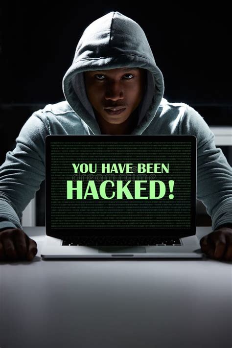 Beware The Dangers Of Cybercrime A Young Hacker Using A Laptop With The Words You Have Been