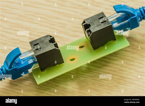 Closeup Of Homemade Ethernet Cable Connector With Blue Ethernet Cables