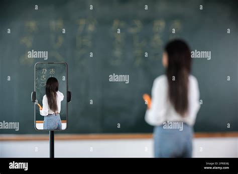 Asian Teacher Teach On Board While Have Blackboard Lecture Online
