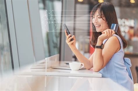 Premium Photo Asian Woman Using Face Recognition Via Smart Mobile Phone Indoors Biometric