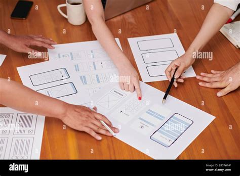 Closeup Image Of Project Manager And Ui And Ux Designers Discussing