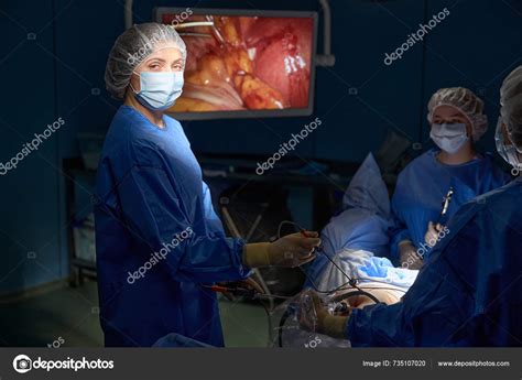 Female Surgeons Protective Uniform Doing Laparoscopic Surgery Big