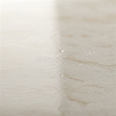 A Smooth Off White Marble Surface With Subtle Veining Is Divided By A