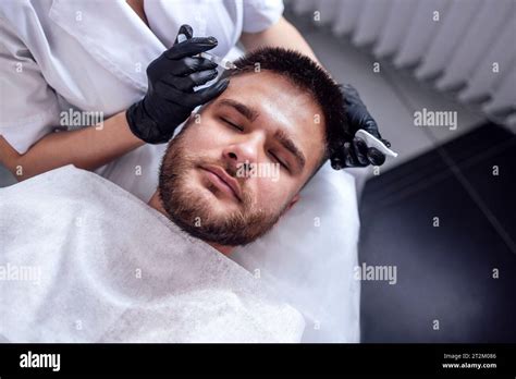 Beauty Injections Female Cosmetologist In Transparent Gloves Makes An Injection In The Lower