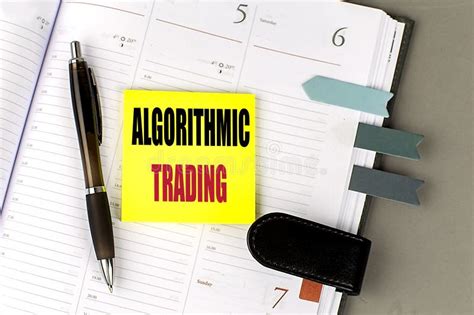 Algorithmic Trading Text On Yellow Sticky Note With Pen And Planner On Gray Desk Stock Image