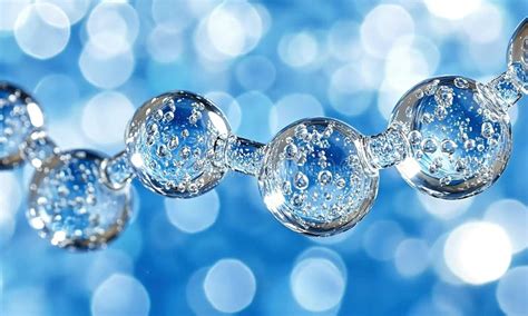 Clear Spherical Molecules Connected In A Chain Against A Blurred Blue Background Stock Video