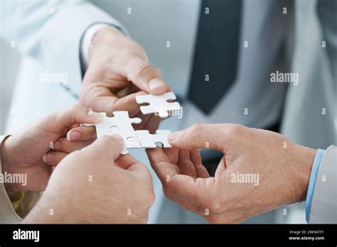 Business People Puzzle And Hands For Teamwork Synergy And Problem Solving In Corporation