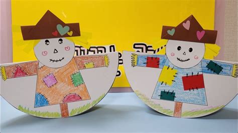 Two Paper Plates With Faces Made To Look Like People Wearing Crowns And Holding Hearts On Their