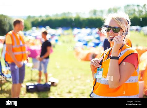 Festival Security Communication And A Woman Outdoor On A Grass Field