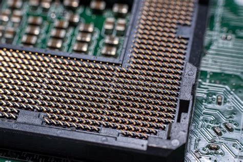 Looking Close Up At The Cpu Socket Pins On The Motherboard Stock Photo Image Of Hand Circuit