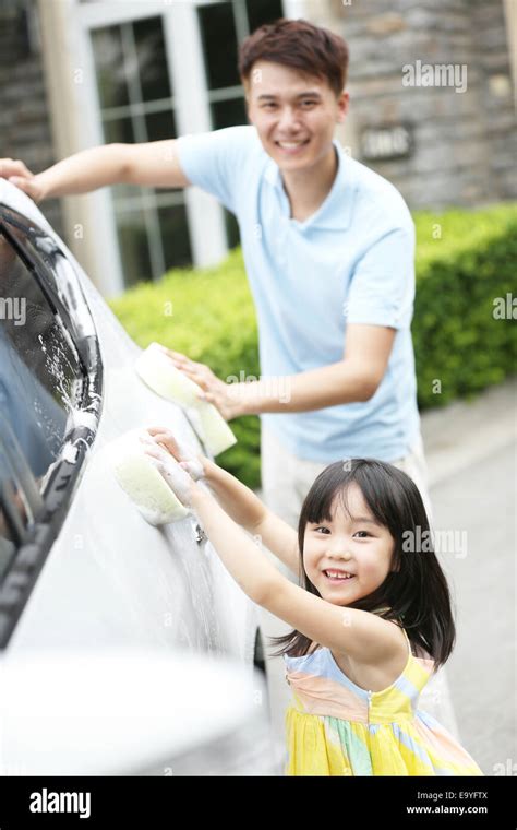 Girl Helping Father Cleaning Car Stock Photo Alamy