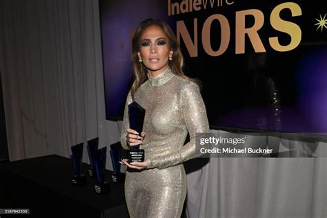 Jennifer Lopez Poses With The Maverick Award For Unstoppable At The