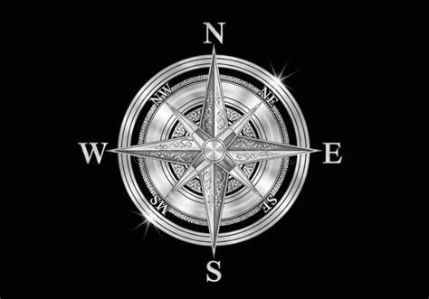 A Detailed Silver Compass Rose With Eight Primary Points Labeled Stock