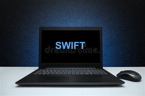 Swift Text On Laptop Screen On Textured Black Background With Blue