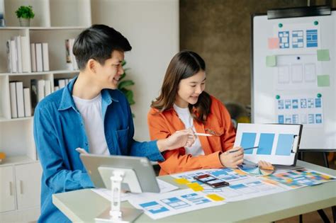 Premium Photo Ux Developer And Ui Designer Brainstorming About Mobile App Interface Wireframe