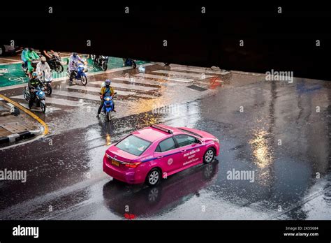 Cars Vans Buses And Motorbikes All Pass Along A Busy Intersection On