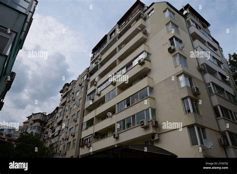 Modern Residential Building Showcasing Contemporary Architecture In An Urban Setting Surrounded