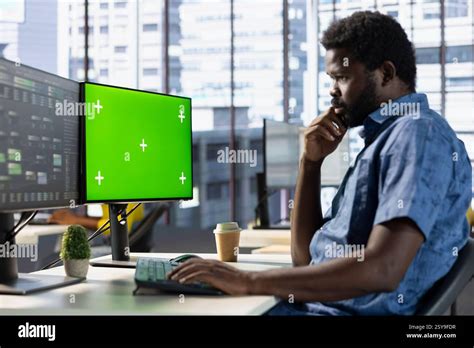 Programmer Conducting Tests On Isolated Screen Computer To Optimize