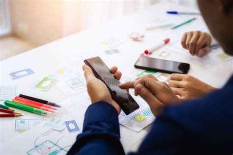 Group Of People Designers Mobile Application Working Wireframe Sketch Drawing Application In