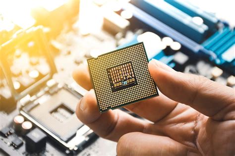 Premium Photo Cpu Processor Chip In Technician Hand And Computer