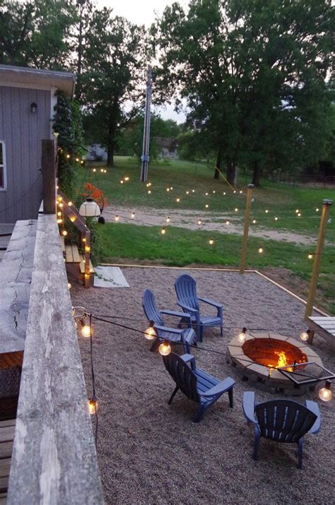 Adding String Lights To Our New Lower Deck Patio Makeover Rustic Fire Pits String Lights Outdoor