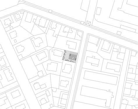 Ofis Arhitekti Adds Grid Of Crosses To Facade Of Ljubljana House