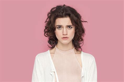 Sad Worried Woman With Curly Hair Having Problems Looking At Camera With Unhappy Expression