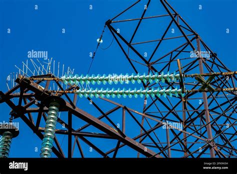 Line Insulator On The Electrical Wires Of A High Voltage Tower