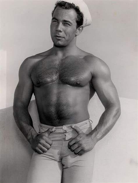 A Black And White Photo Of A Shirtless Man With His Hands On His Hips