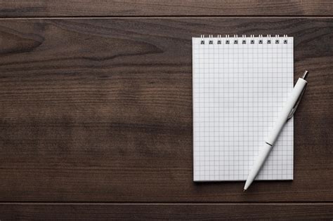 Premium Photo Blank Notebook And White Pen