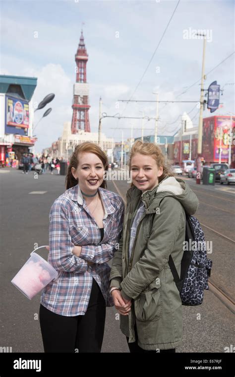 Teenagers Eating Candy Floss In Blackpool Lancashire Uk In Background The Famous Blackpool Tower