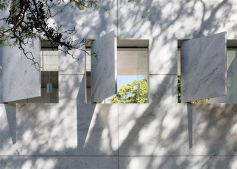 Triptyques Marble Building Is Made To Look Like An Ice Cube