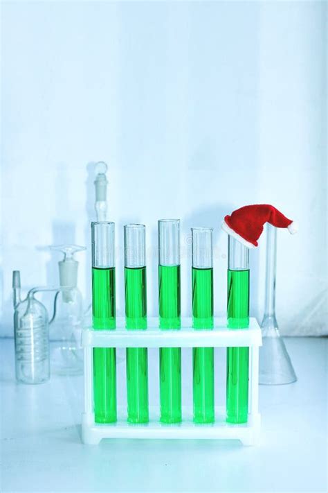 Five Vials Of Green Solution In A Chemical Lab On The End Tube Is A Miniature Decorative Red