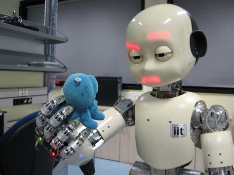 The Icub Humanoid Robot [16] Inquisitively Gazing At A Toy Octopus