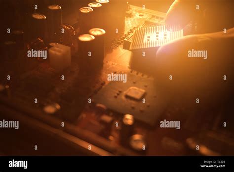 Technician Plug In CPU Microprocessor To Motherboard Socket Stock Photo Alamy