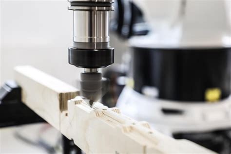 left robotic fabrication of a reconwood beam right robotic milling